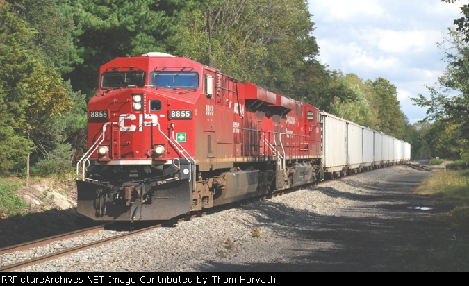 CP 39T approaches Main Street with a consist of 11 loaded hoppers